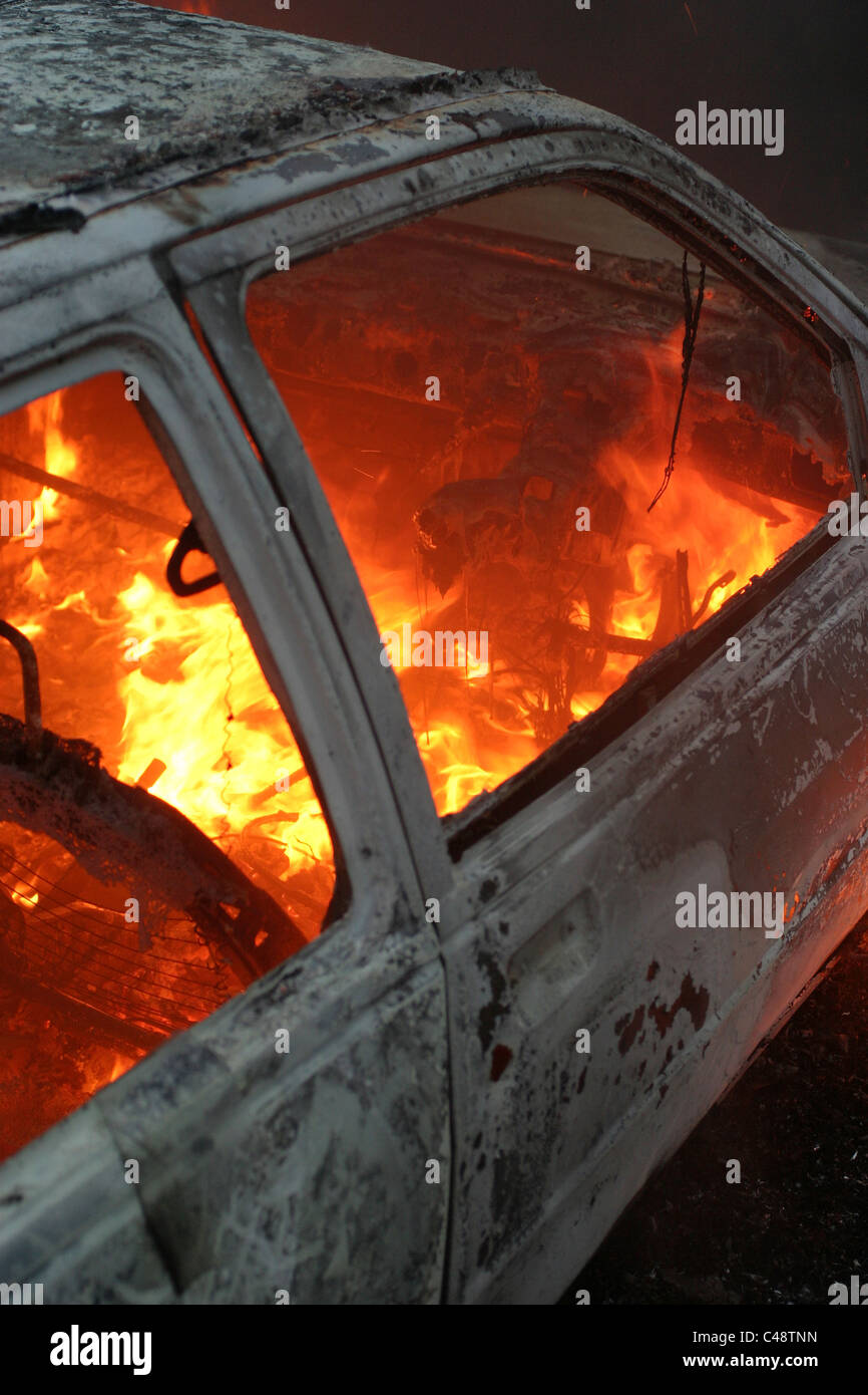 Stolen car gutted by fire Stock Photo - Alamy
