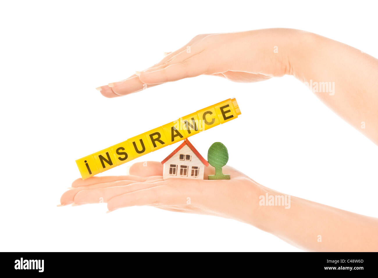 Woman's hands holding house and word insurance Stock Photo - Alamy