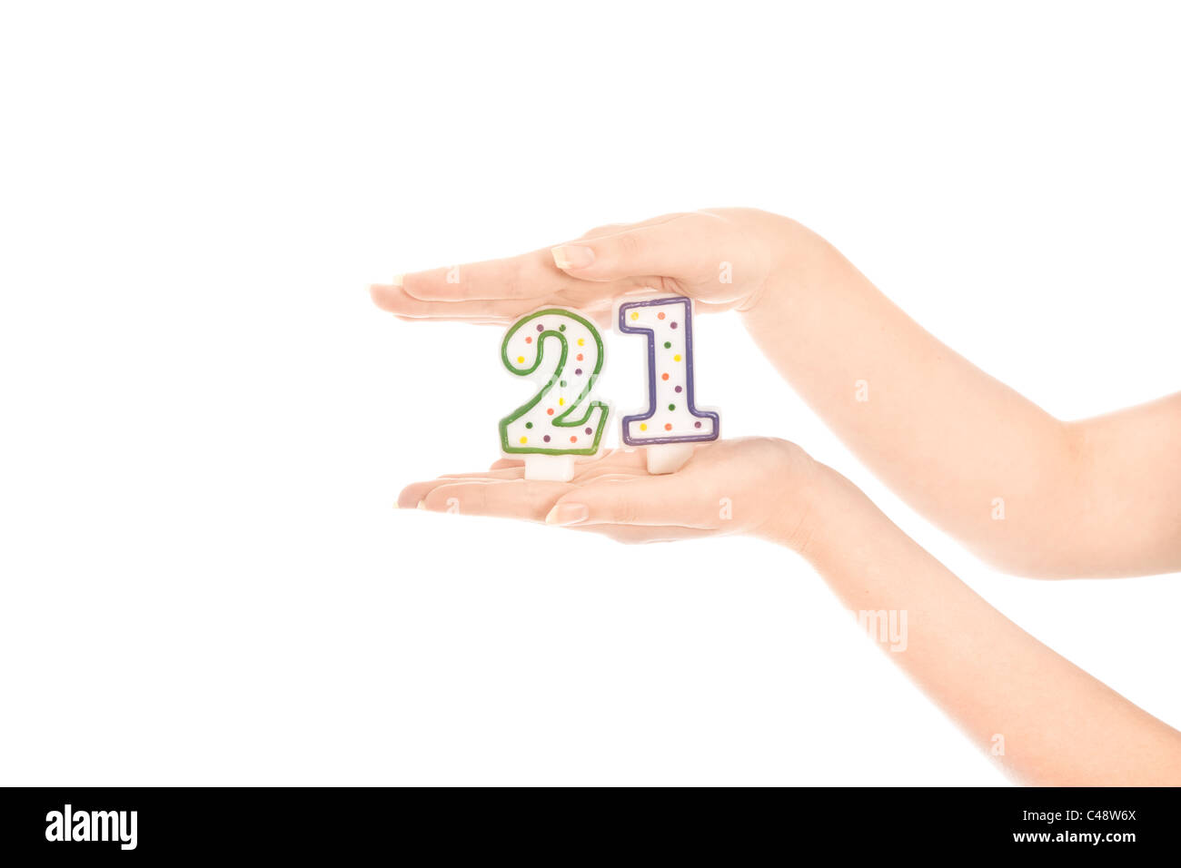 Woman hands holding two candles on the white background Stock Photo - Alamy