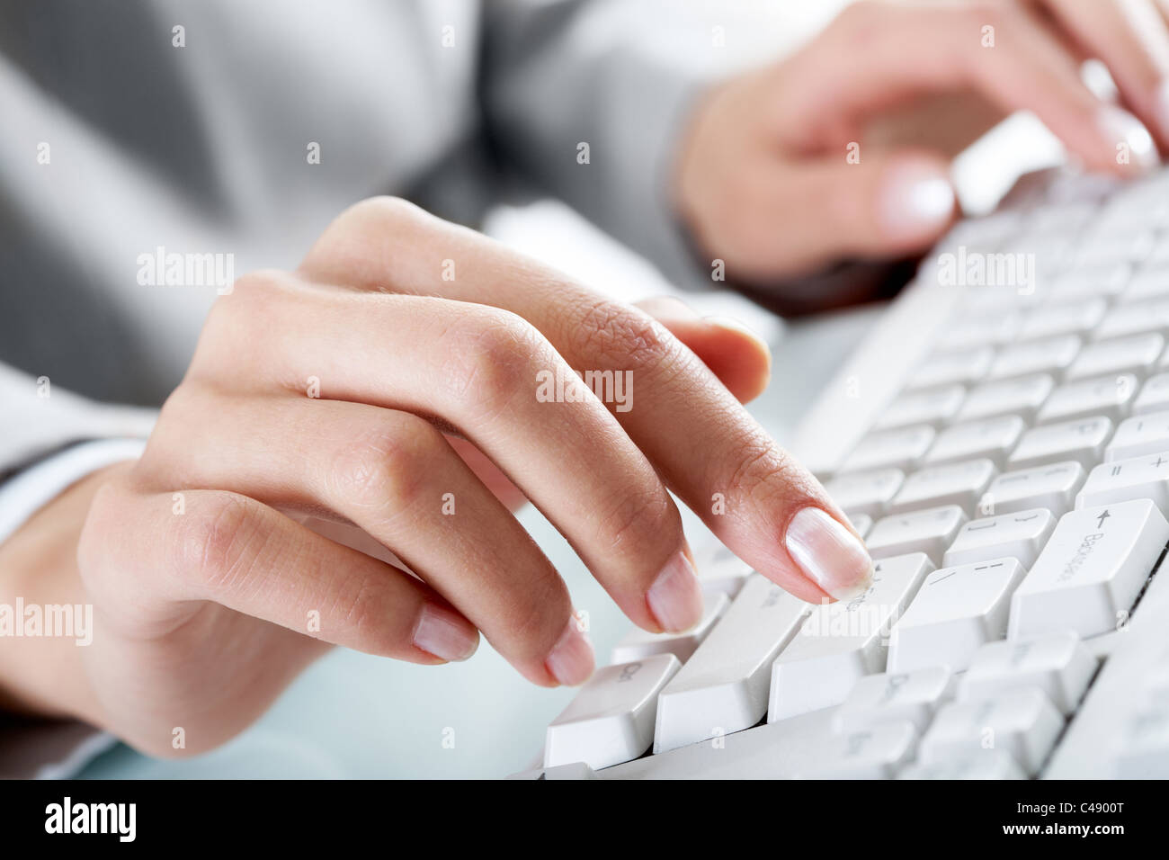 Macro image of human hand with forefinger going to press key on ...