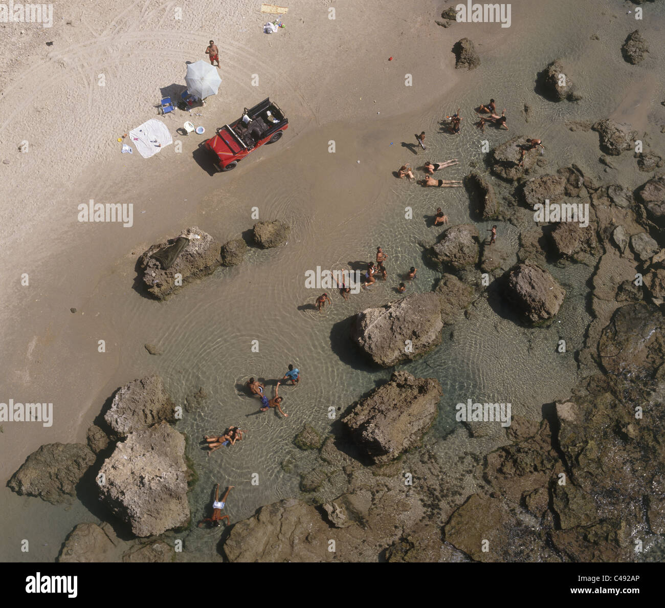 Aerial photograph of people bathing in the water of the Mediterranean ...