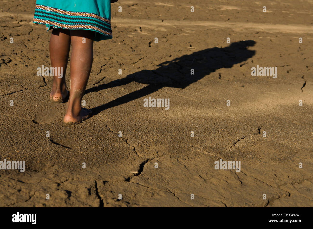 Girl walking barefoot on the lake shore, Spioenkop dam, KwaZulu-Natal ...