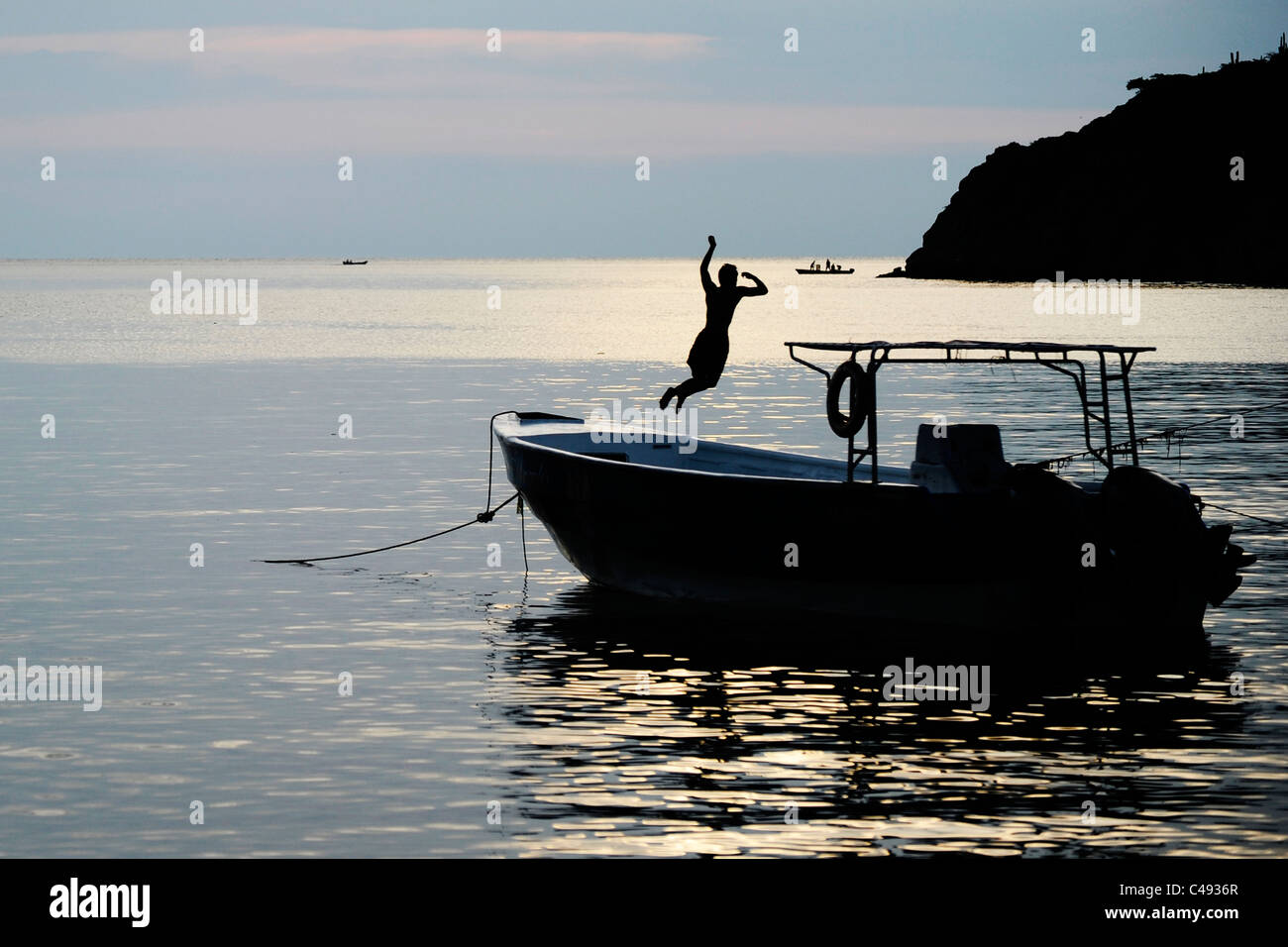 Boy jumping boat hi-res stock photography and images - Alamy