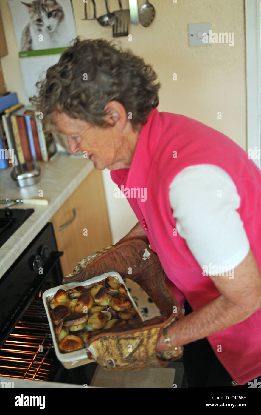 Female elderly OAP serving up a Lancashire Hot Pot for dinner UK Stock ...