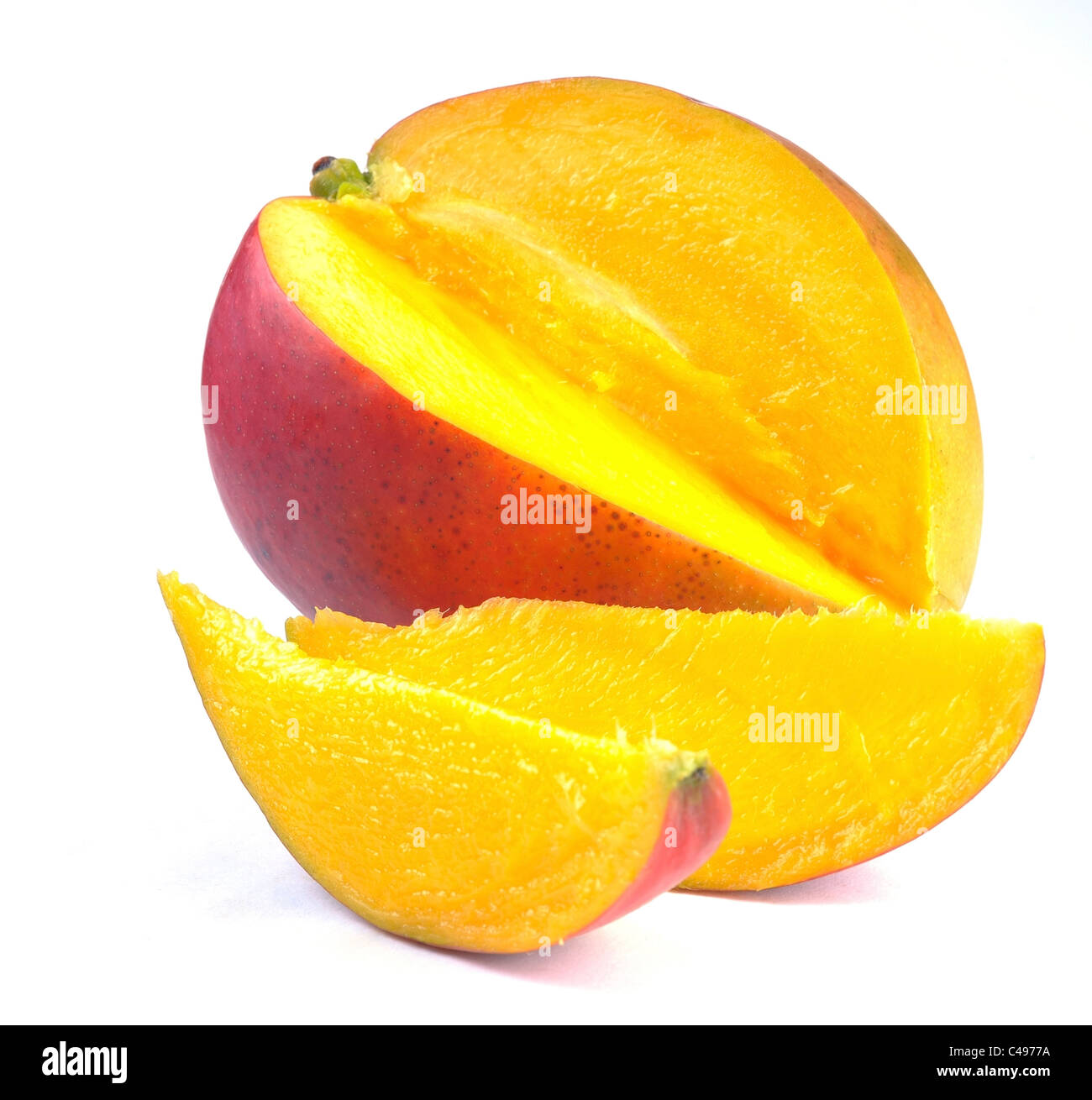 Mango with section on a white background Stock Photo - Alamy