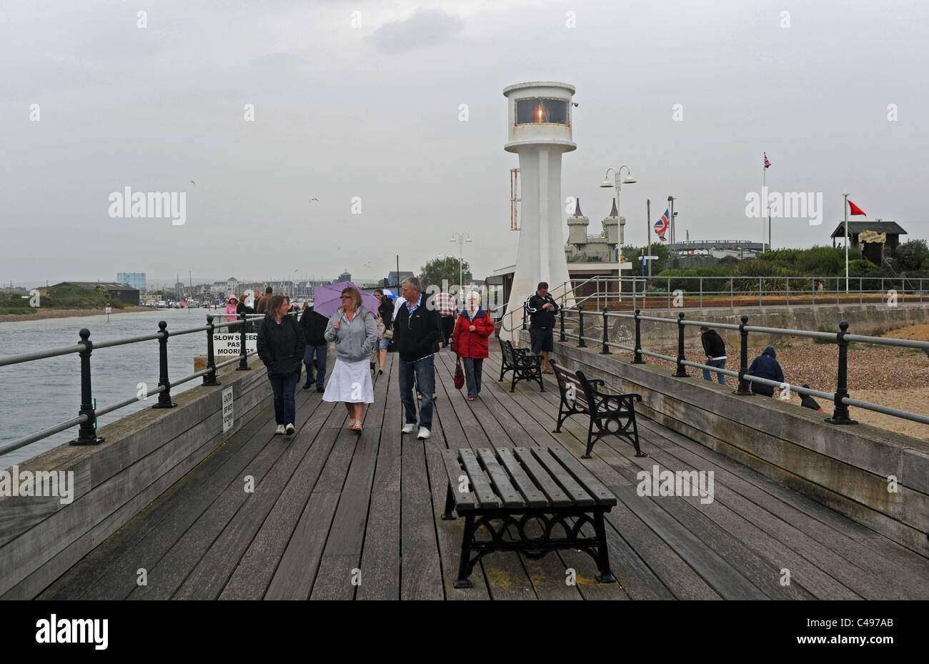 The lighthouse with its light on during a dull cold summer day at the ...