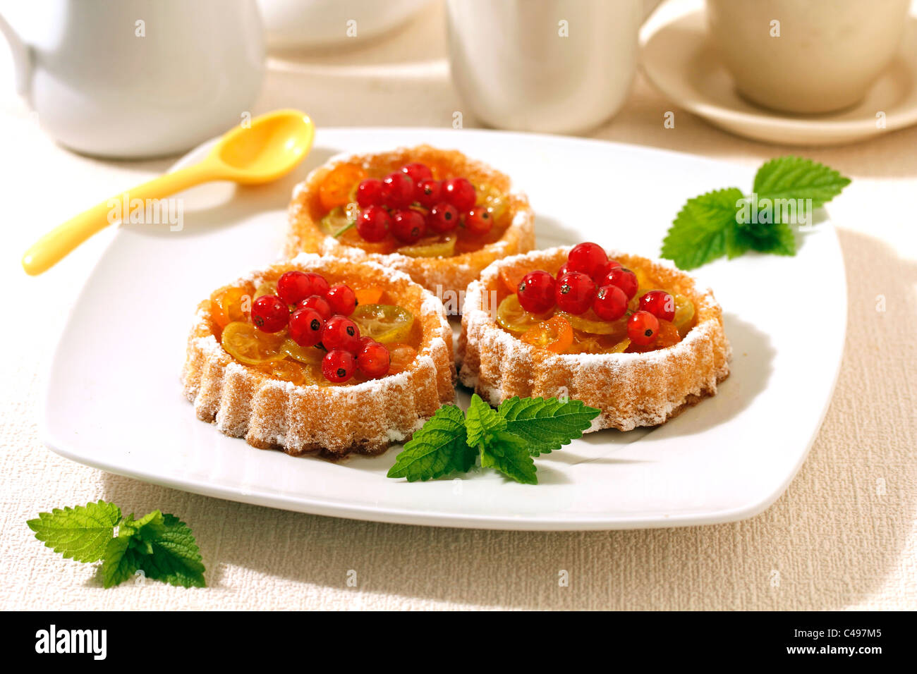 Little citrus fruits tartlets. Recipe available Stock Photo - Alamy