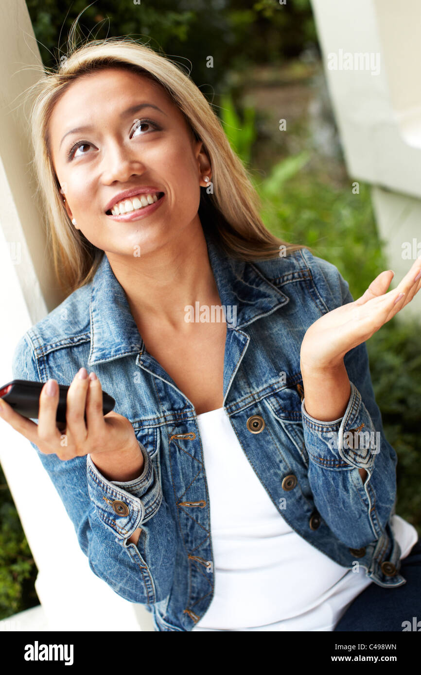 Girl excited receiving message on her phone Stock Photo - Alamy