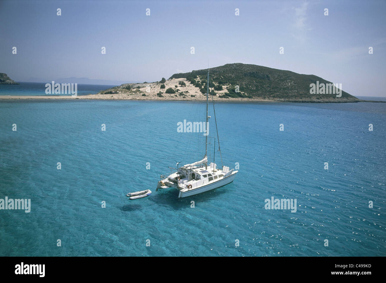 Aerial photograph of a Yacht anchor in a blue lagune of the Greek ...