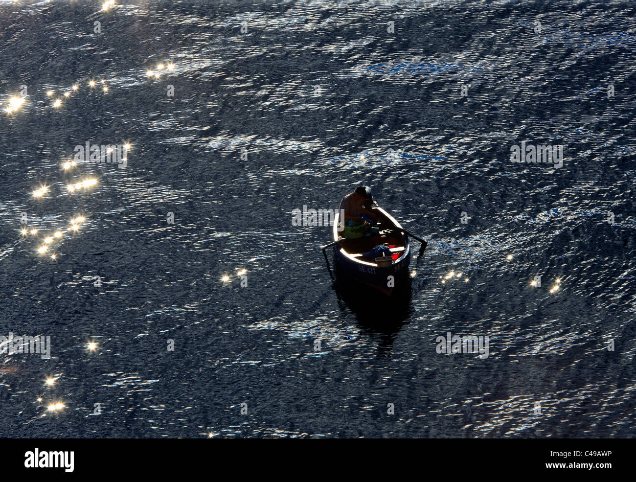 Fisherman in boat sea hi-res stock photography and images - Alamy