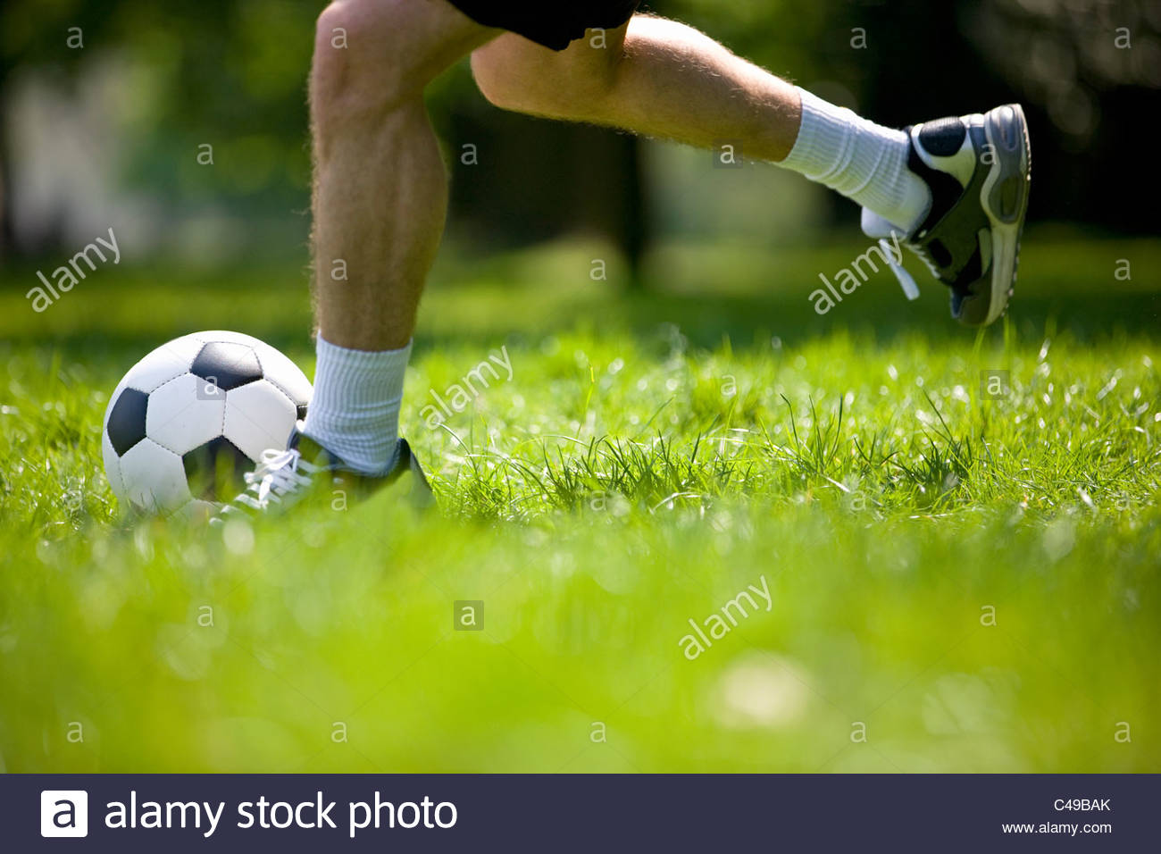 Footballer Kicking Ball Stock Photos & Footballer Kicking Ball Stock ...