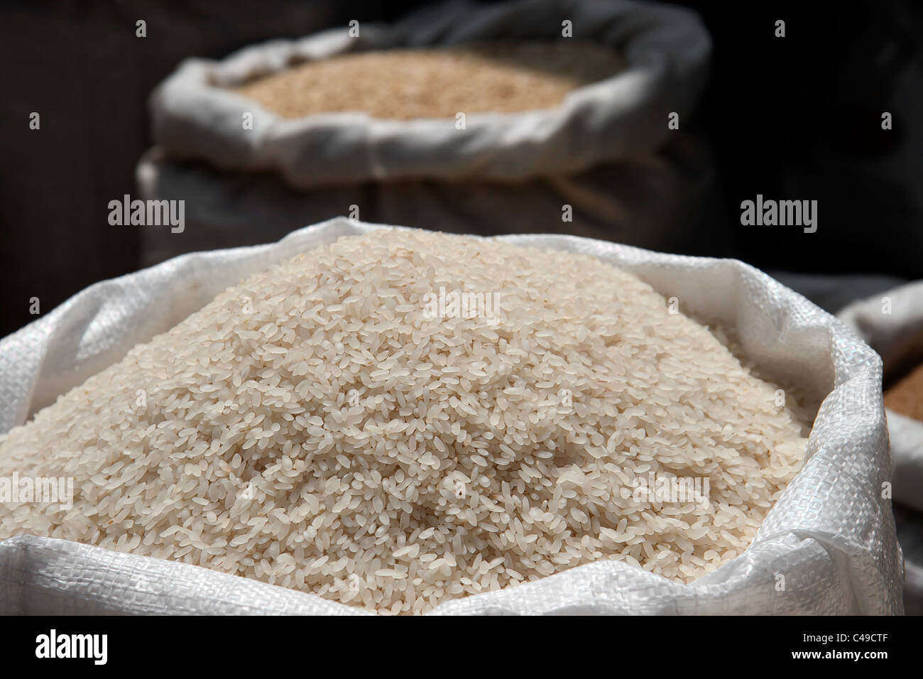 A close up to a pile of rice in the sacks Stock Photo - Alamy