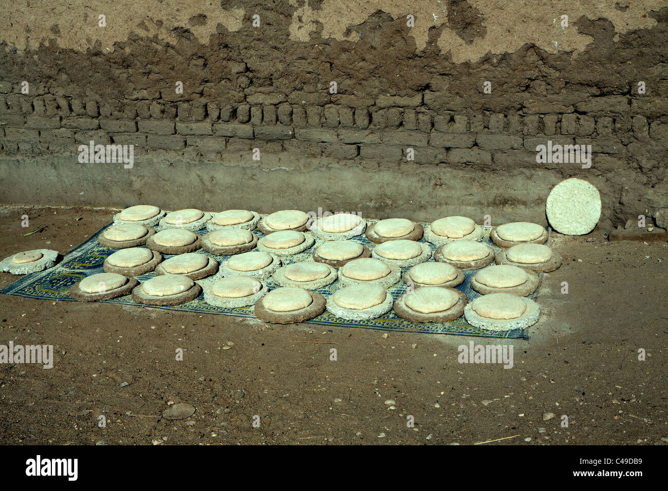 Platters of bread drying in the early morning sun Stock Photo - Alamy