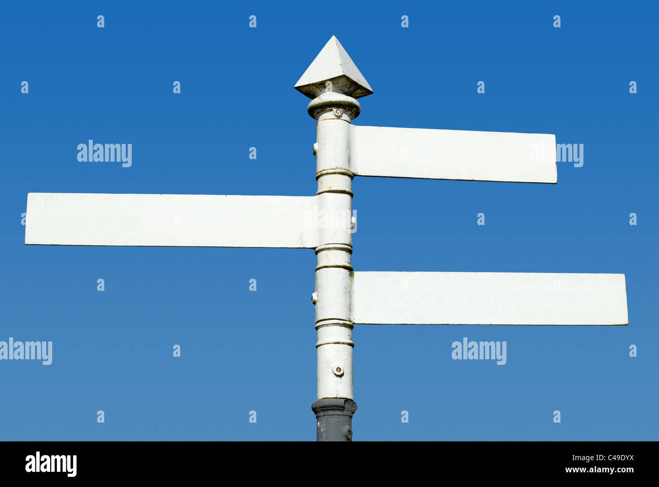 Old fashioned English 3 way blank direction signpost Stock Photo - Alamy