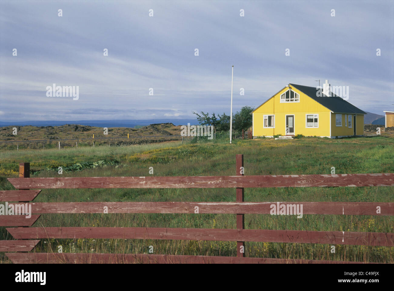 Photograph of a yellow house in Iceland Stock Photo - Alamy