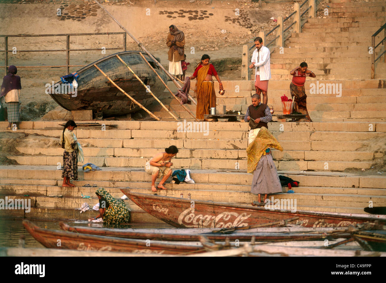 Photograph of people on a river bank in Varanasi India Stock Photo - Alamy
