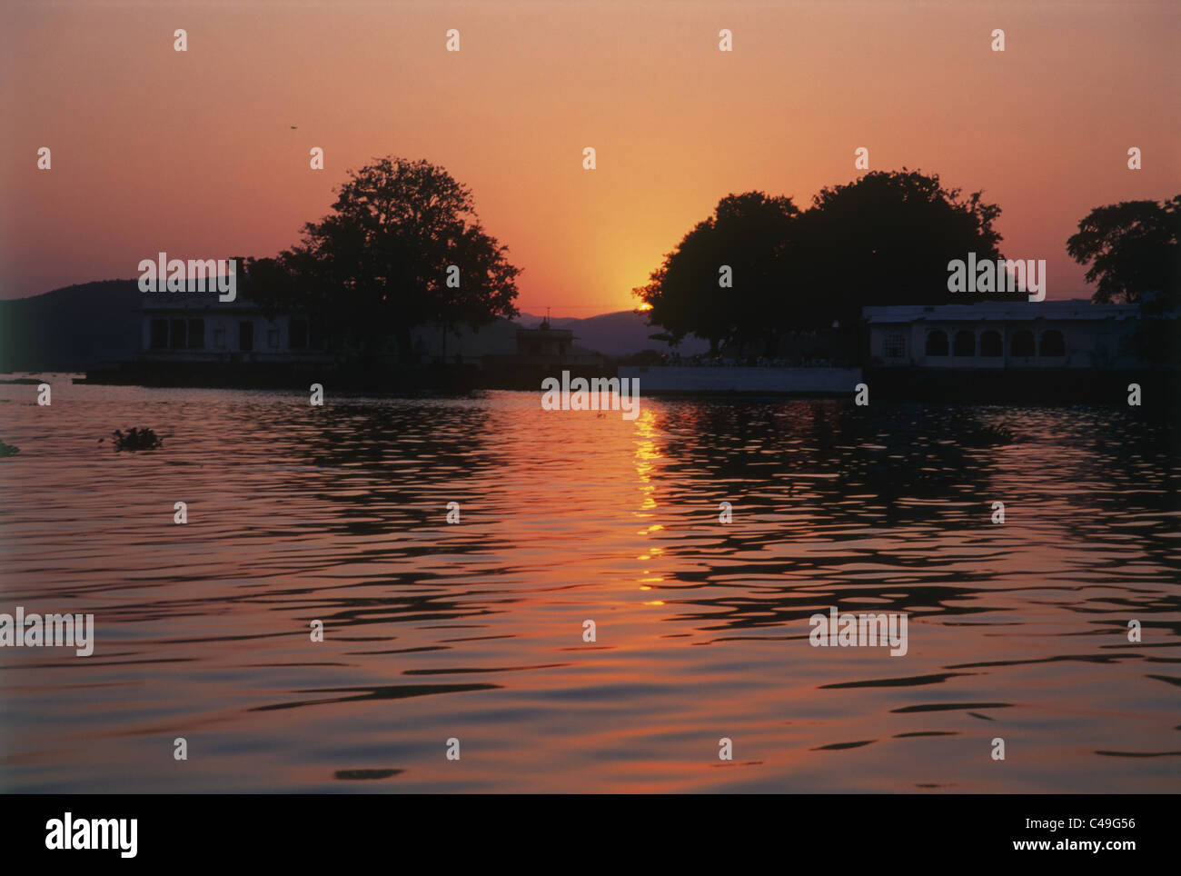 Photograph of the sunset over an Indian village in Udaipur Stock Photo ...