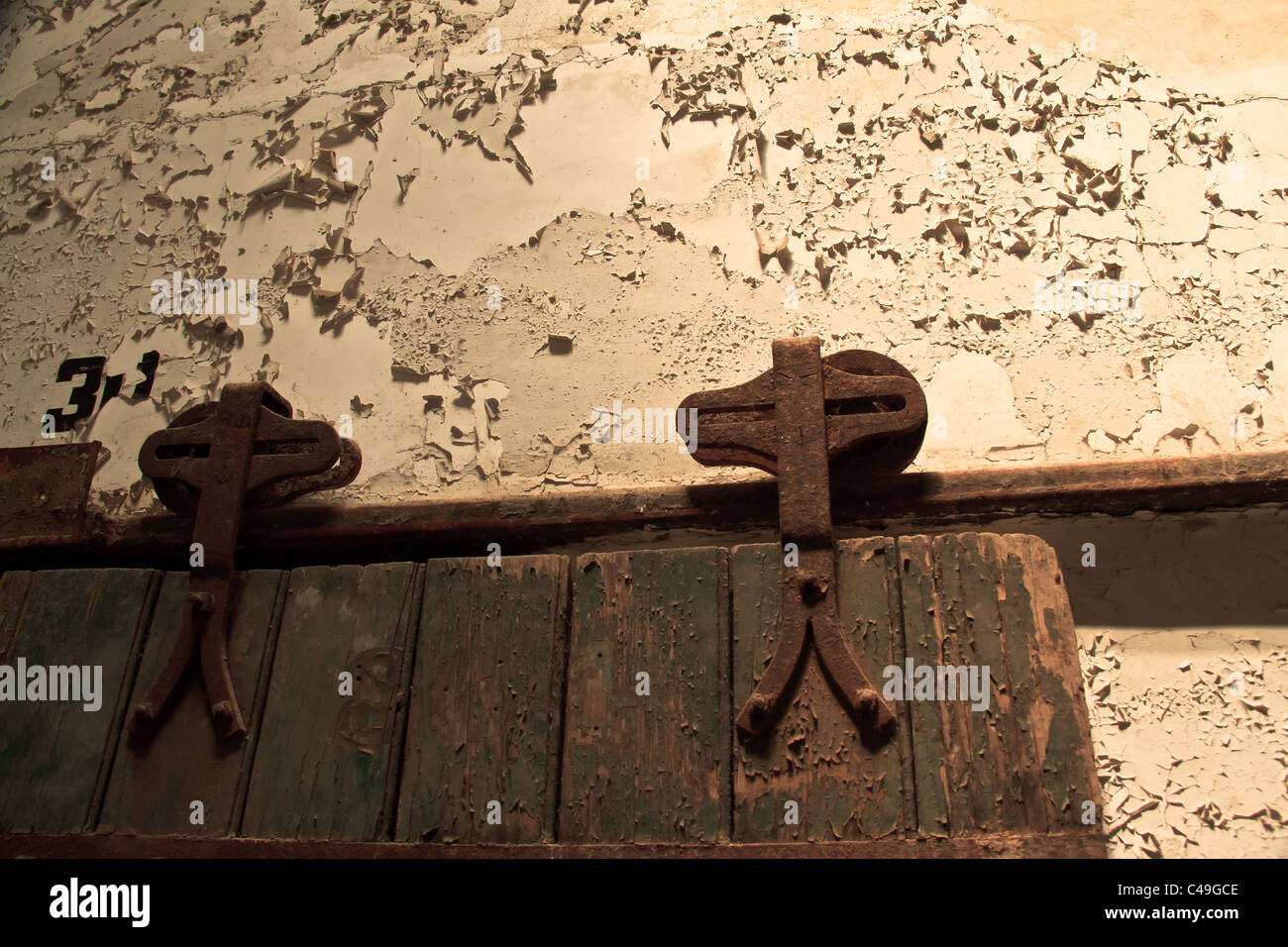 Cell doors had small rails to open and close them Stock Photo - Alamy