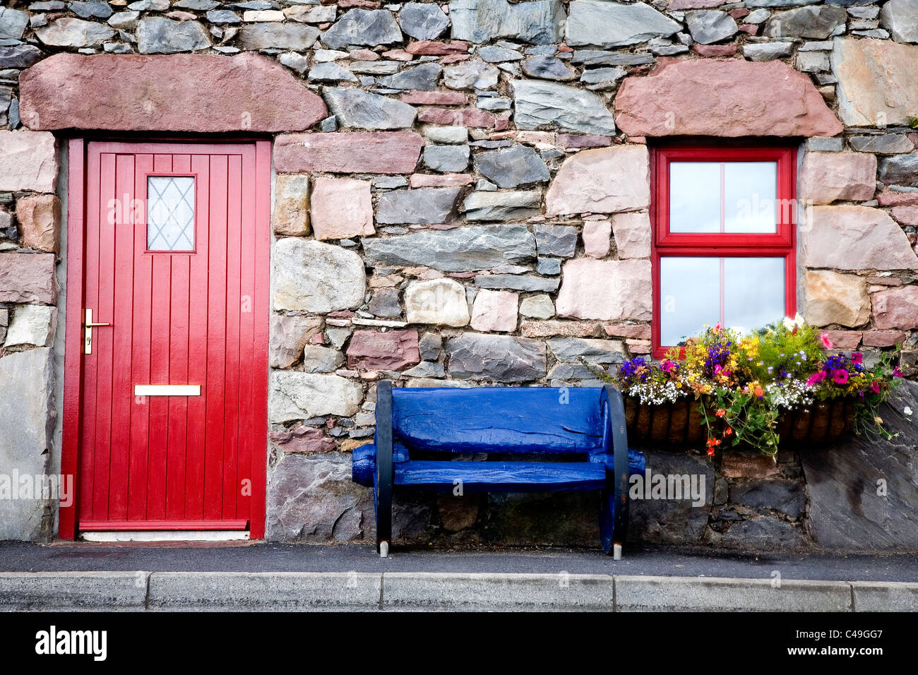 Photograph of a stone house in an Irish village Stock Photo - Alamy