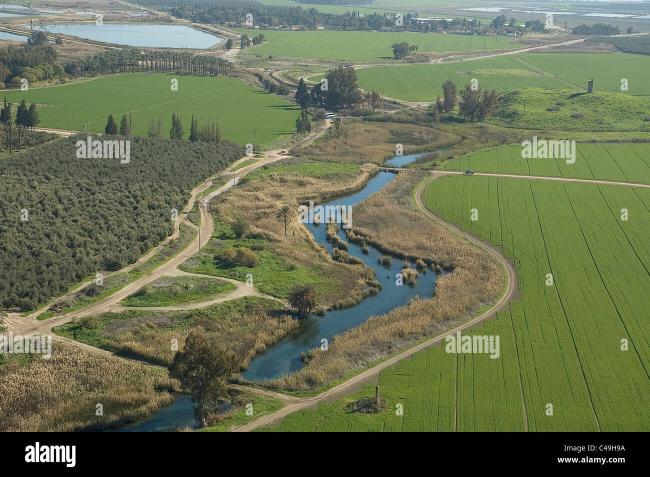 Aerial photograph of the Kibutzim river in the eastern Jezreel valley ...