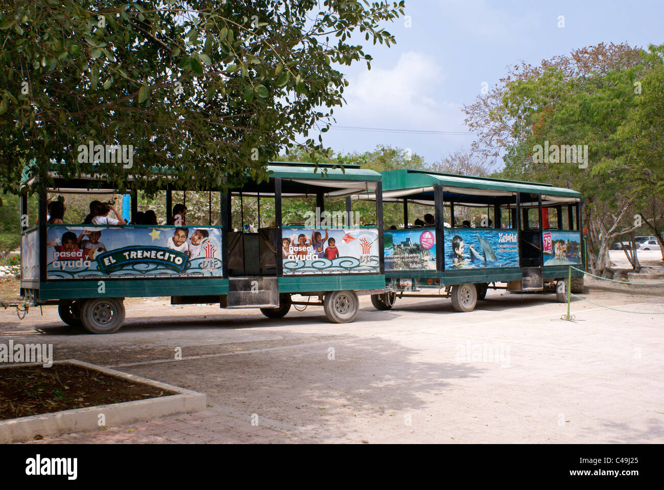 Tourist train at the Mayan ruins of Tulum on the Riviera Maya, Quintana ...