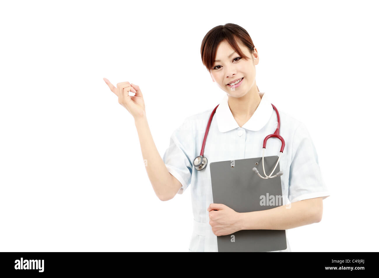 Young asian female nurse pointing Stock Photo - Alamy
