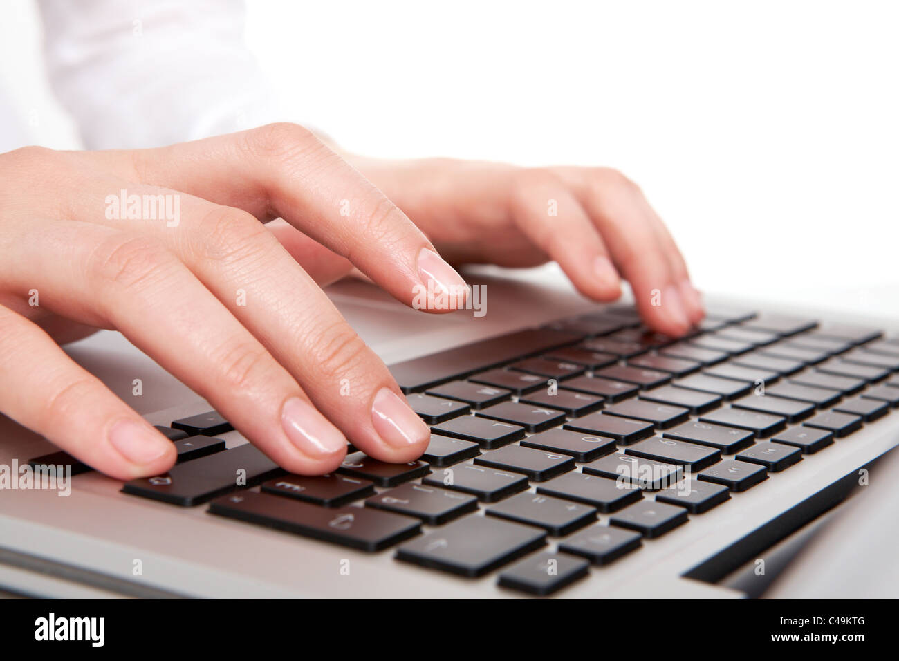 Macro image of human hands typing on keyboard Stock Photo - Alamy