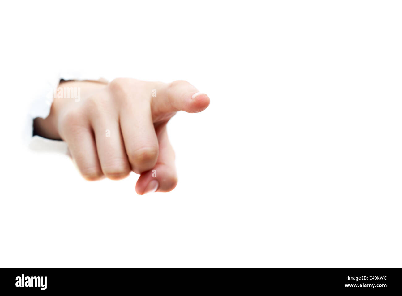 Image of human hand making pointing gesture through torn paper Stock ...