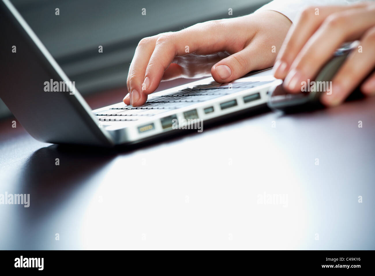 Image of human hands pressing keys of laptop Stock Photo - Alamy