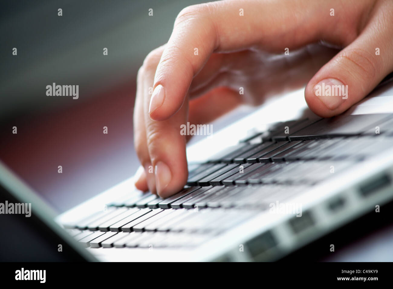Close-up of female hand touching buttons of keyboard Stock Photo - Alamy