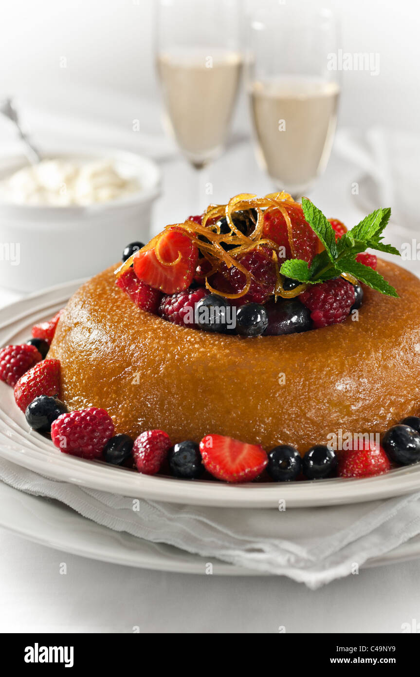 Savarin with fruit. Traditional dessert Stock Photo - Alamy