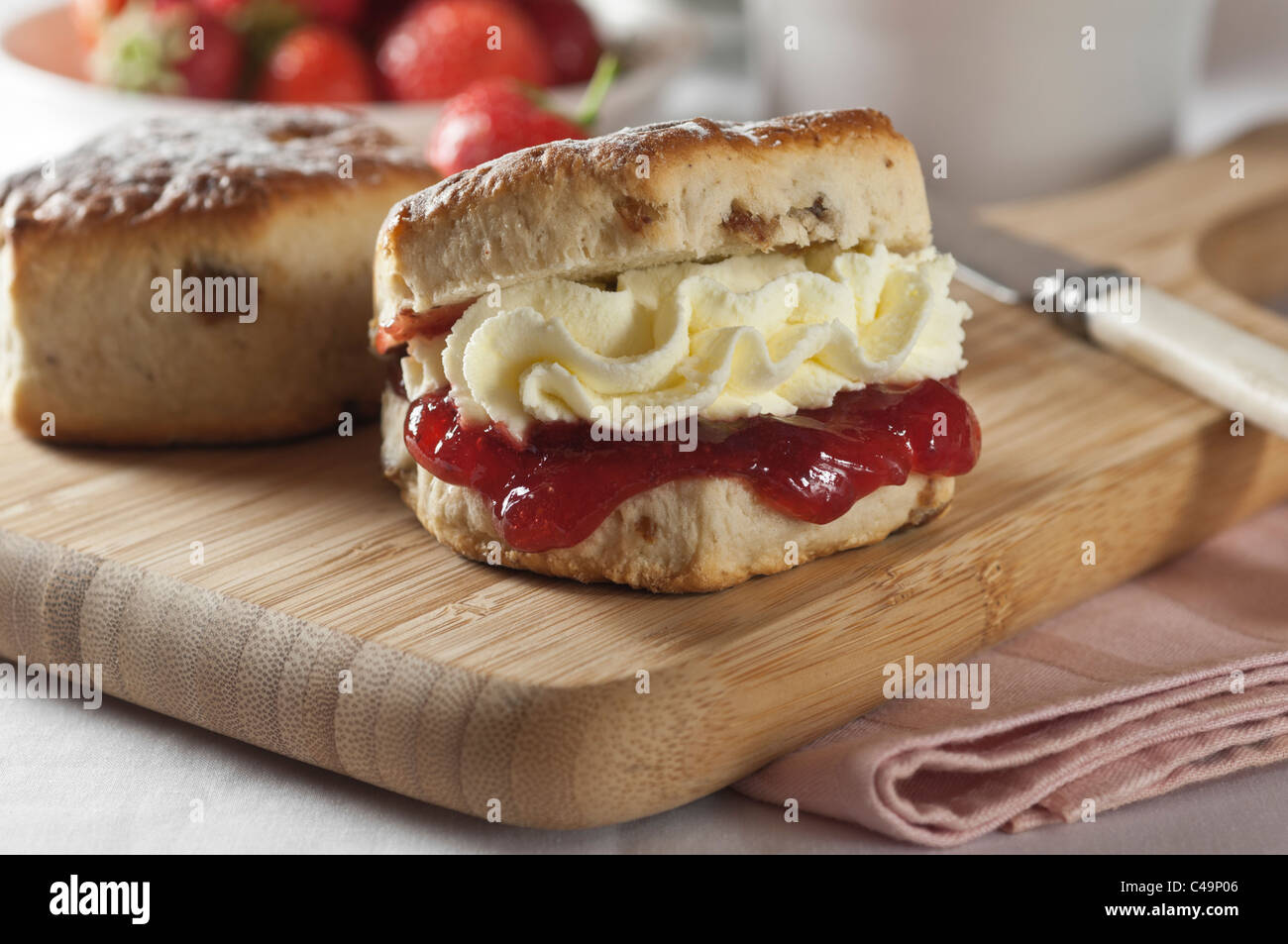 Traditional English scones with strawberry jam and cream Stock Photo ...