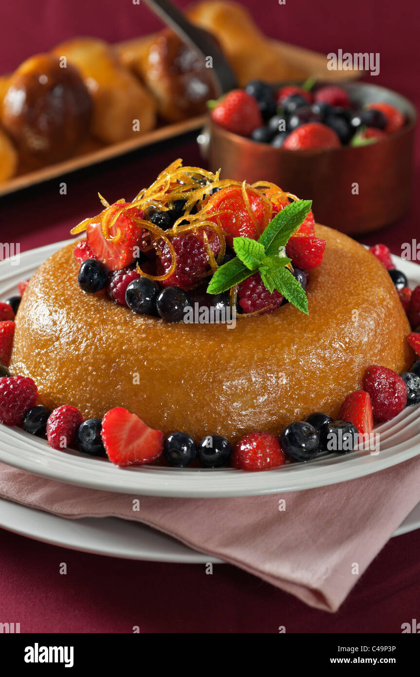 Savarin with fruit. Traditional dessert Stock Photo - Alamy