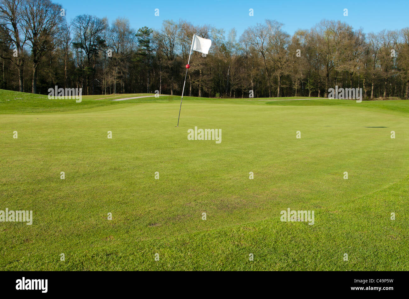 golf course with white flag Stock Photo - Alamy