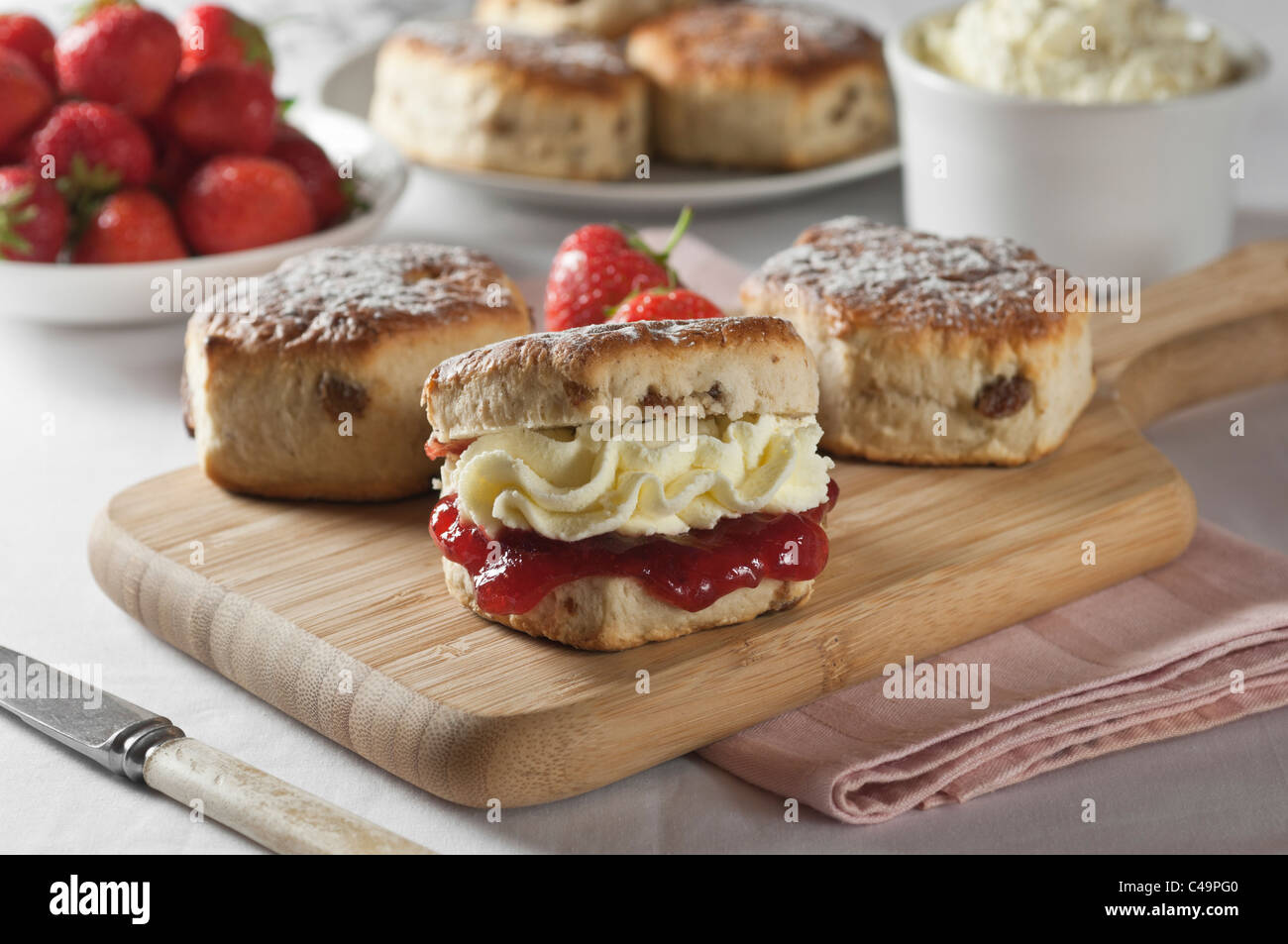 Traditional English scones with strawberry jam and cream Stock Photo ...