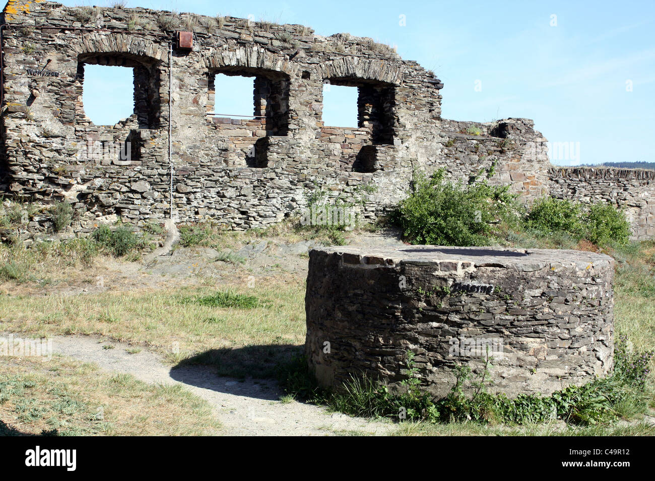 Old castle wall and well Stock Photo - Alamy