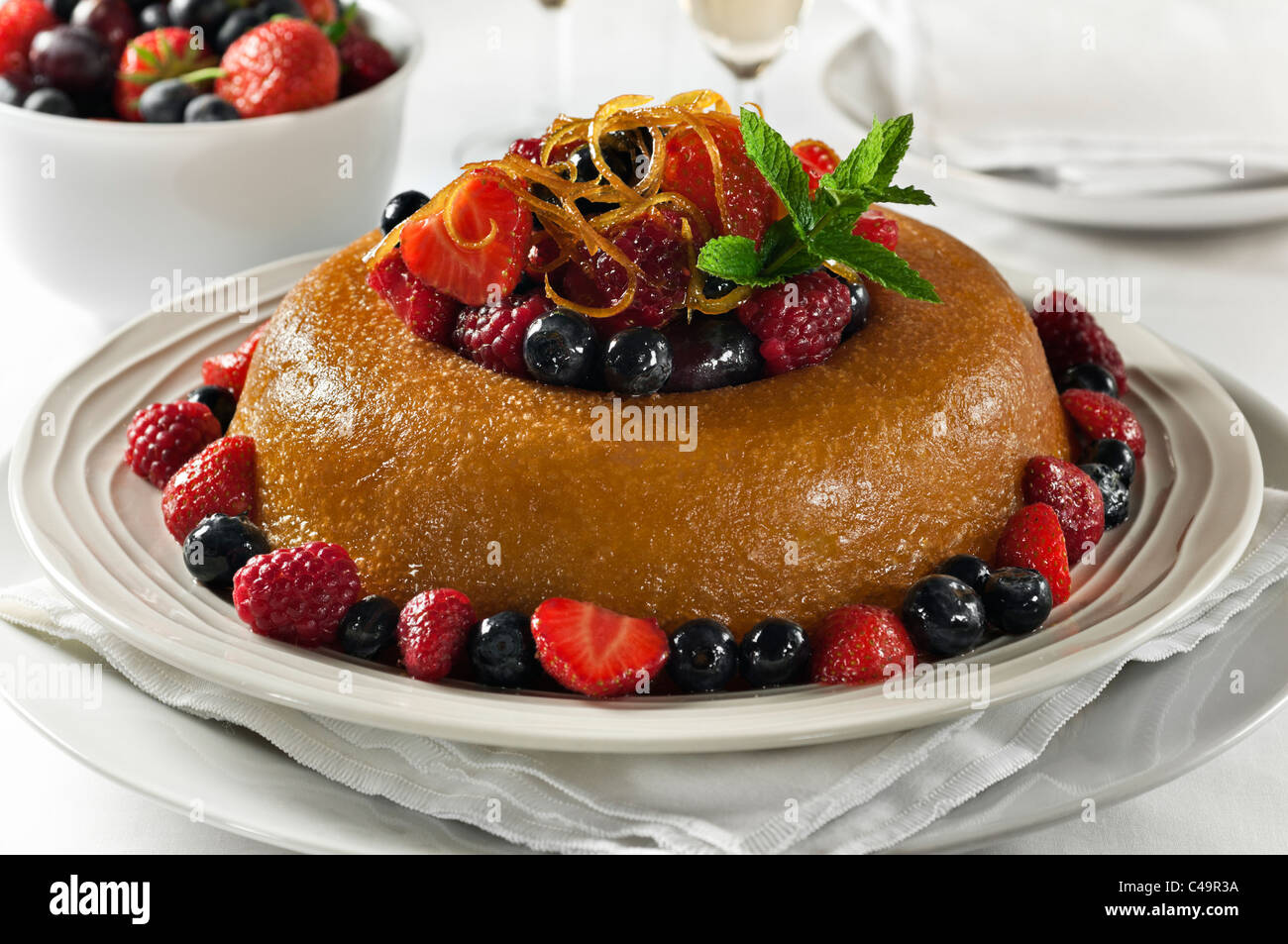 Savarin with fruit. Traditional dessert Stock Photo - Alamy