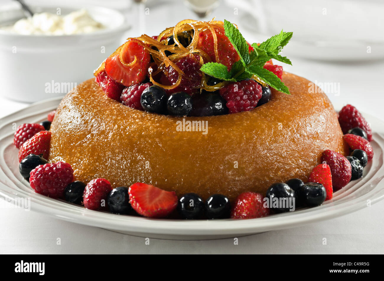 Savarin with fruit. Traditional dessert Stock Photo - Alamy