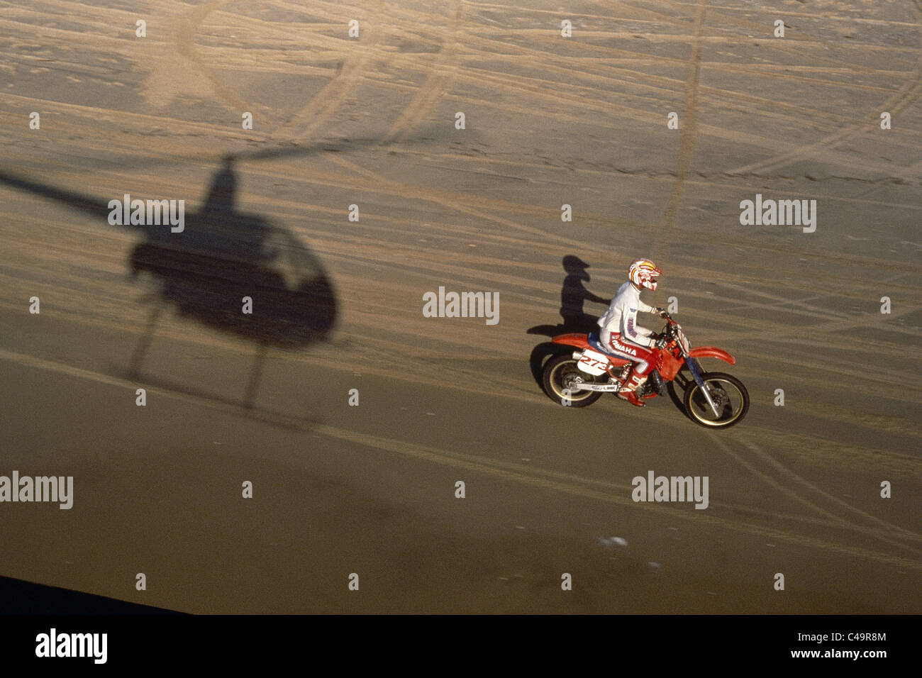 Aerial photograph of a motorcycle on the beach at the coastal plain ...