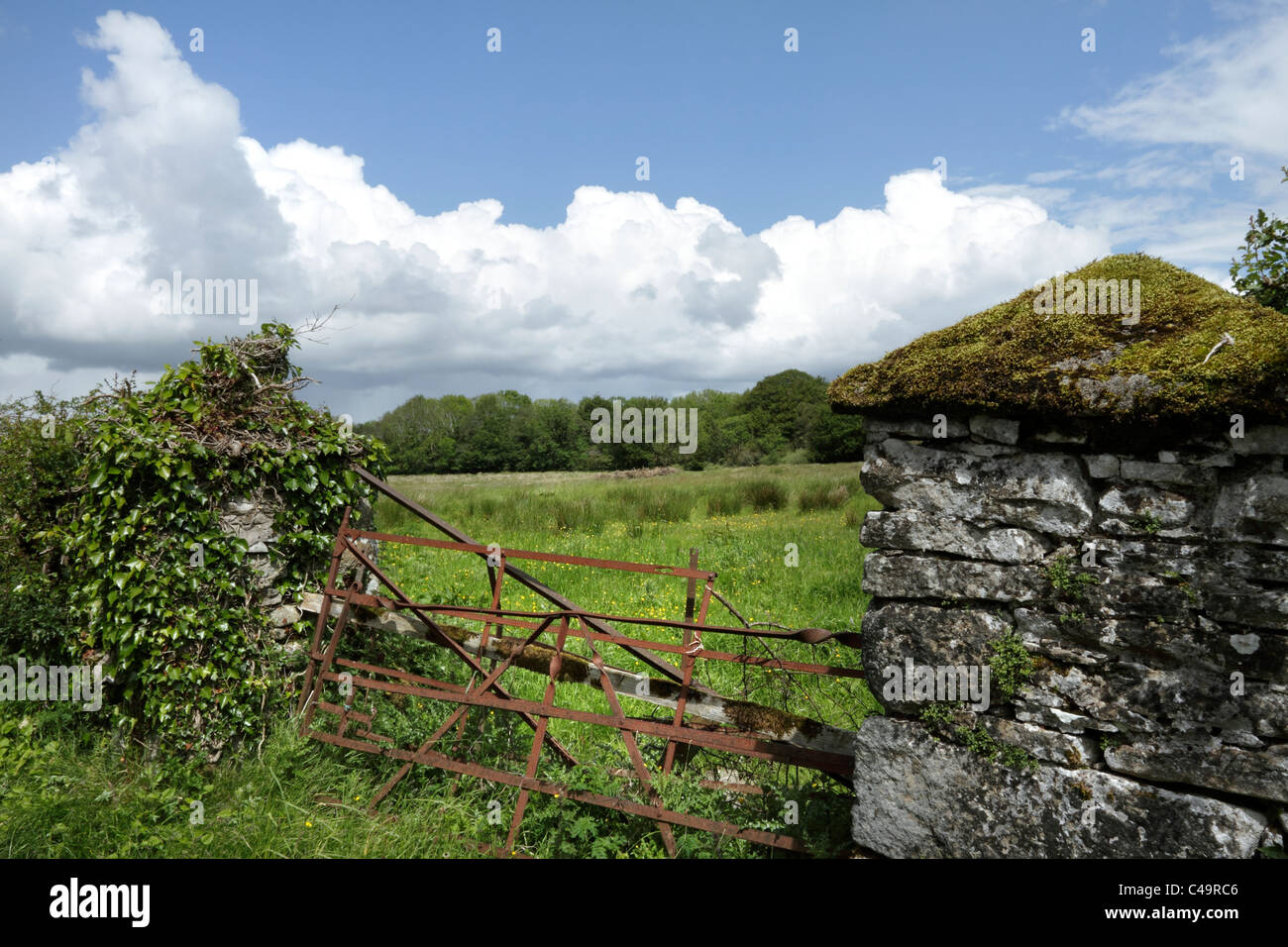 Old stone fence and iron barrier, County Mayo Republic of Ireland Stock ...