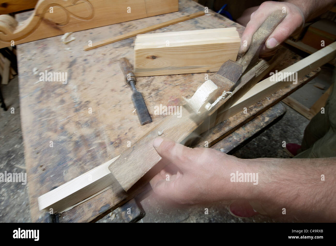 forefront of a carpenter working with a carpenter's plane Stock Photo ...