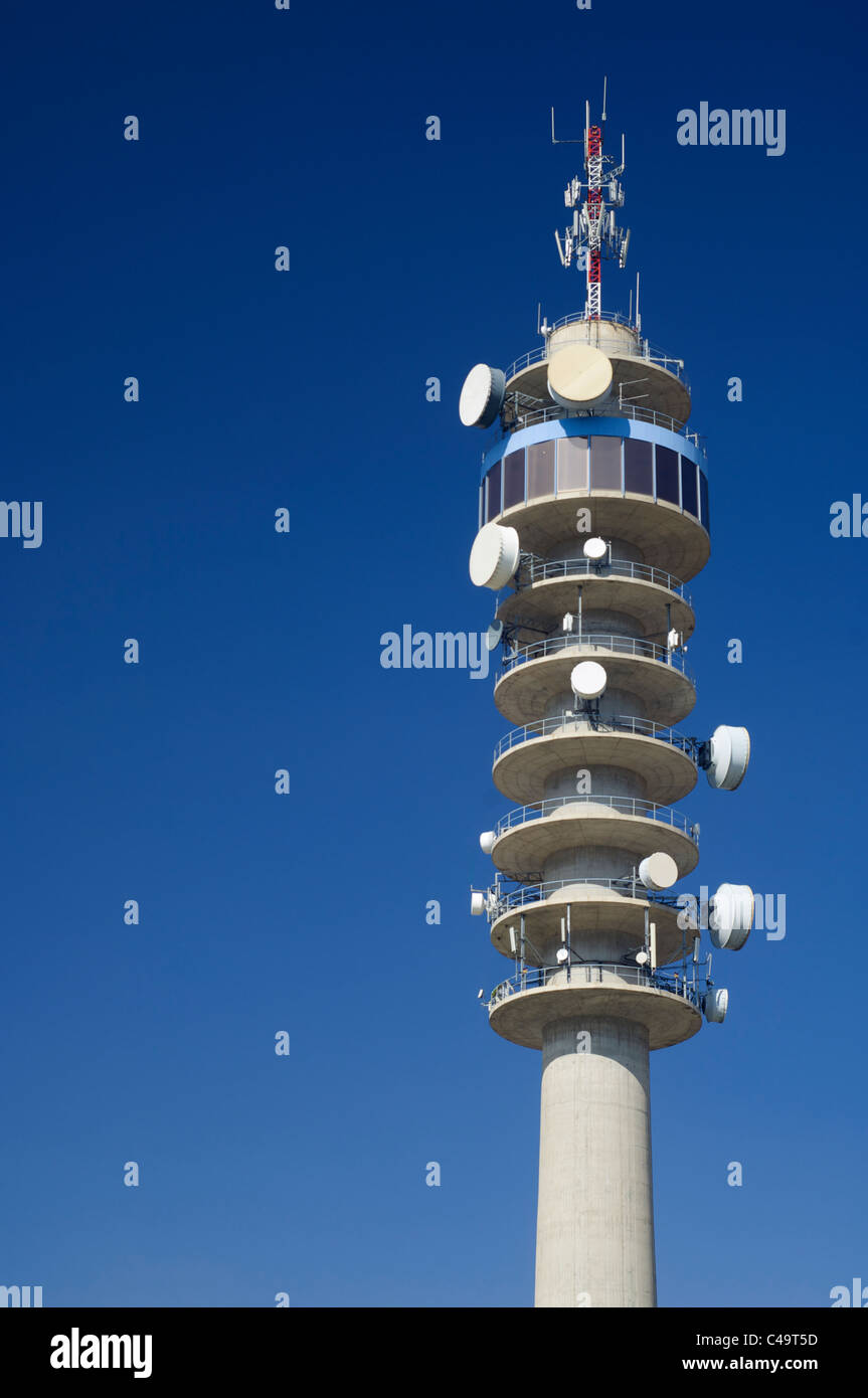 view of a large telecommunications tower with a clear blue sky in ...