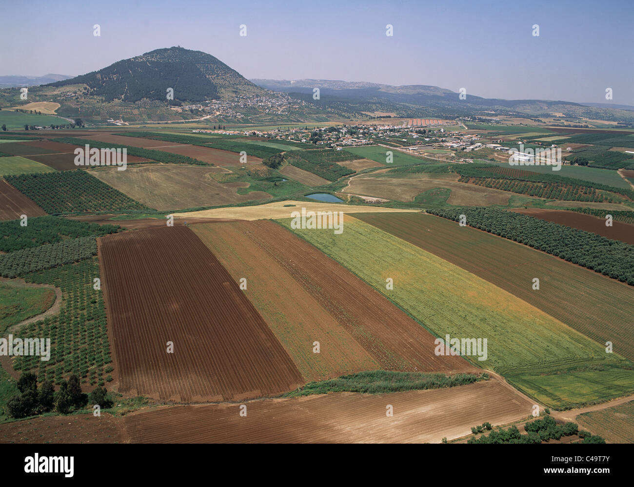 Aerial photograph of mount Tavor and the green fields Kfar Tavor in the ...