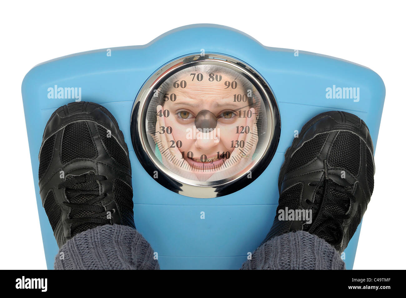 Weight scale with desperate woman's face reflecting isolated in white ...
