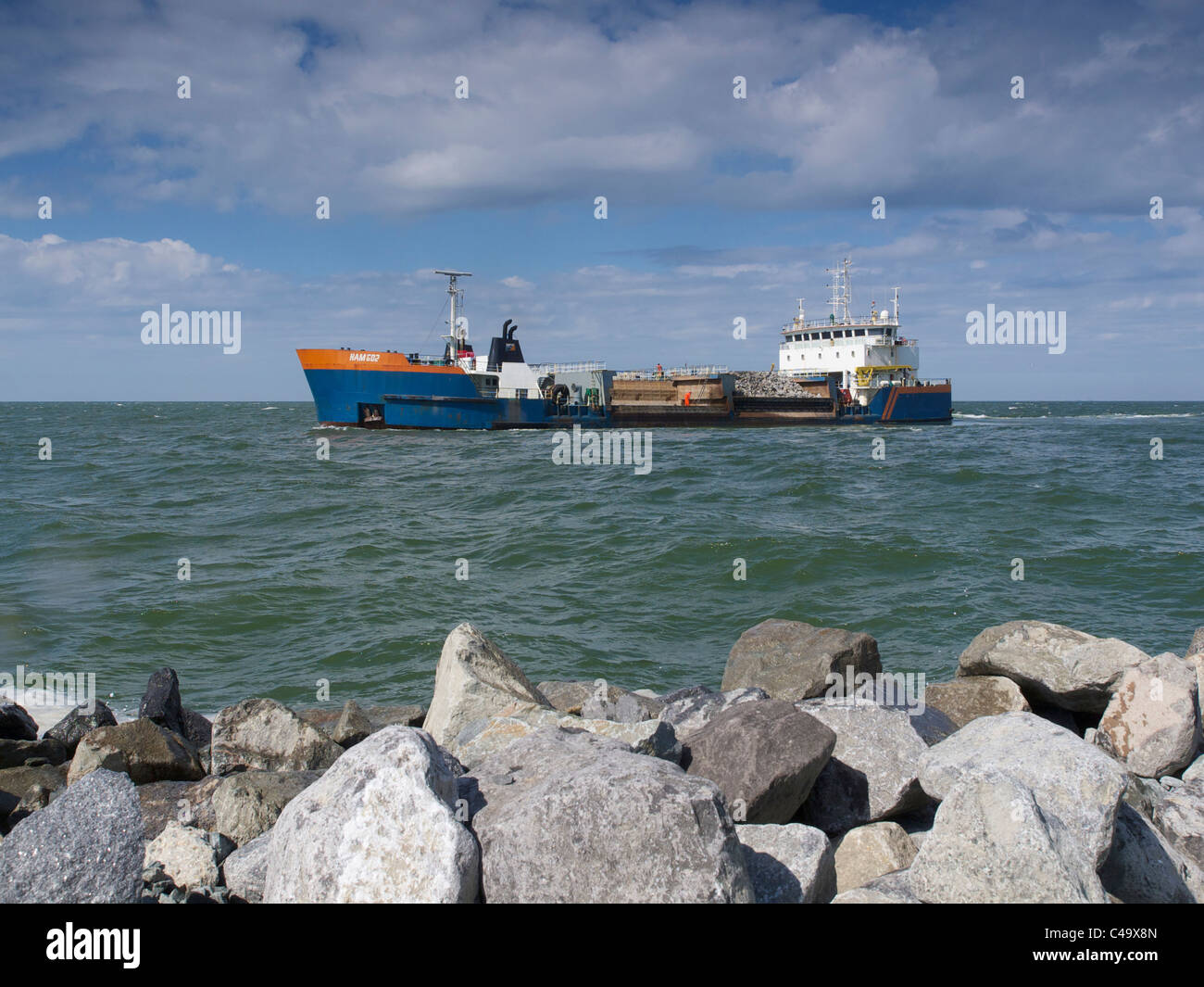 Ship on the North Sea carrying stones for the Maasvlakte 2 construction ...