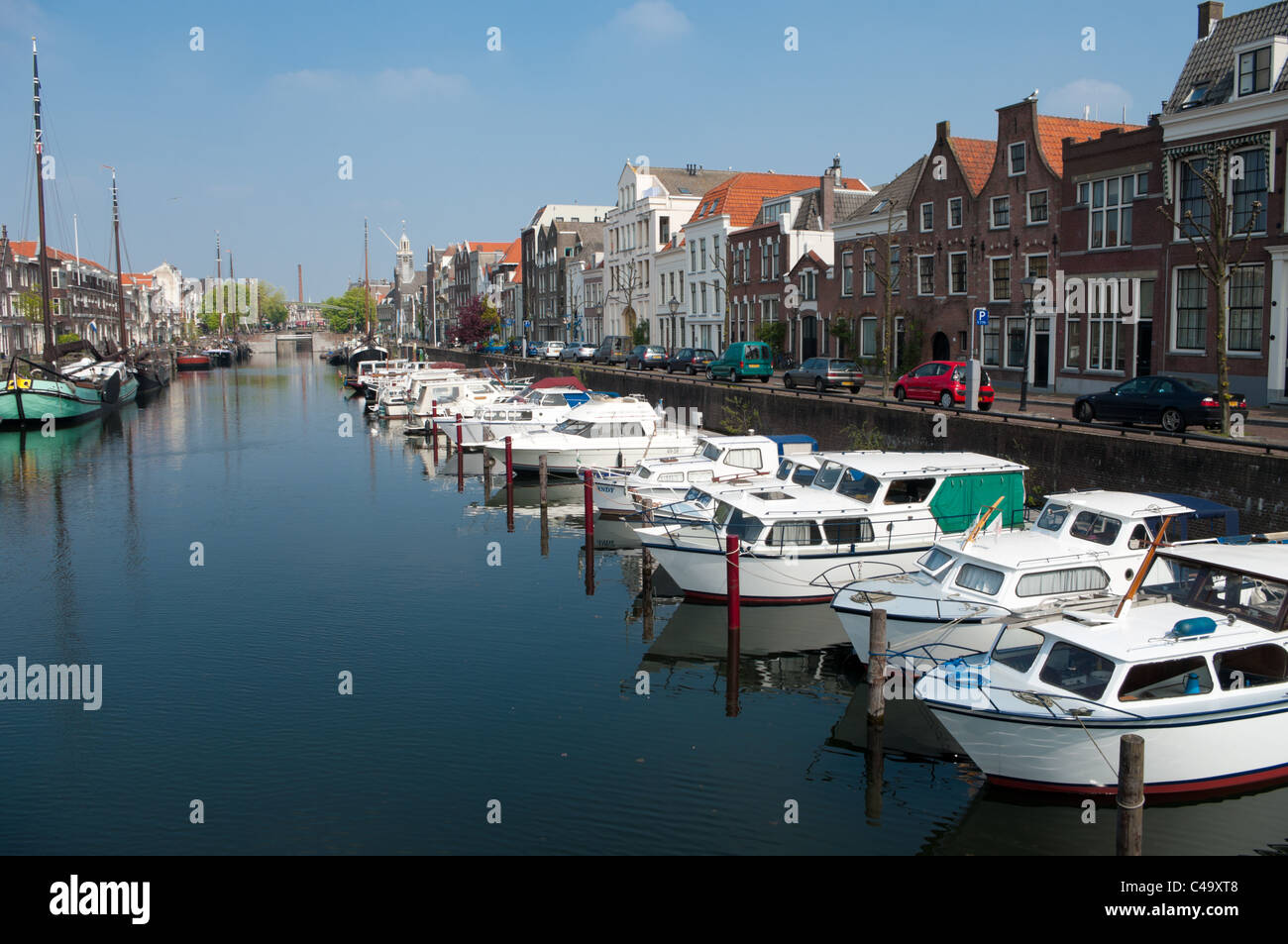 several yachts moored in the monumental harbor of delfshaven ...