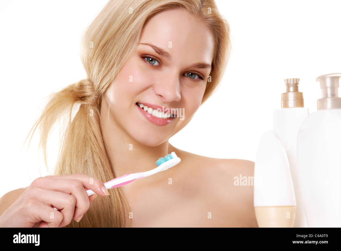 Image of pretty female with toothbrush looking at camera Stock Photo ...