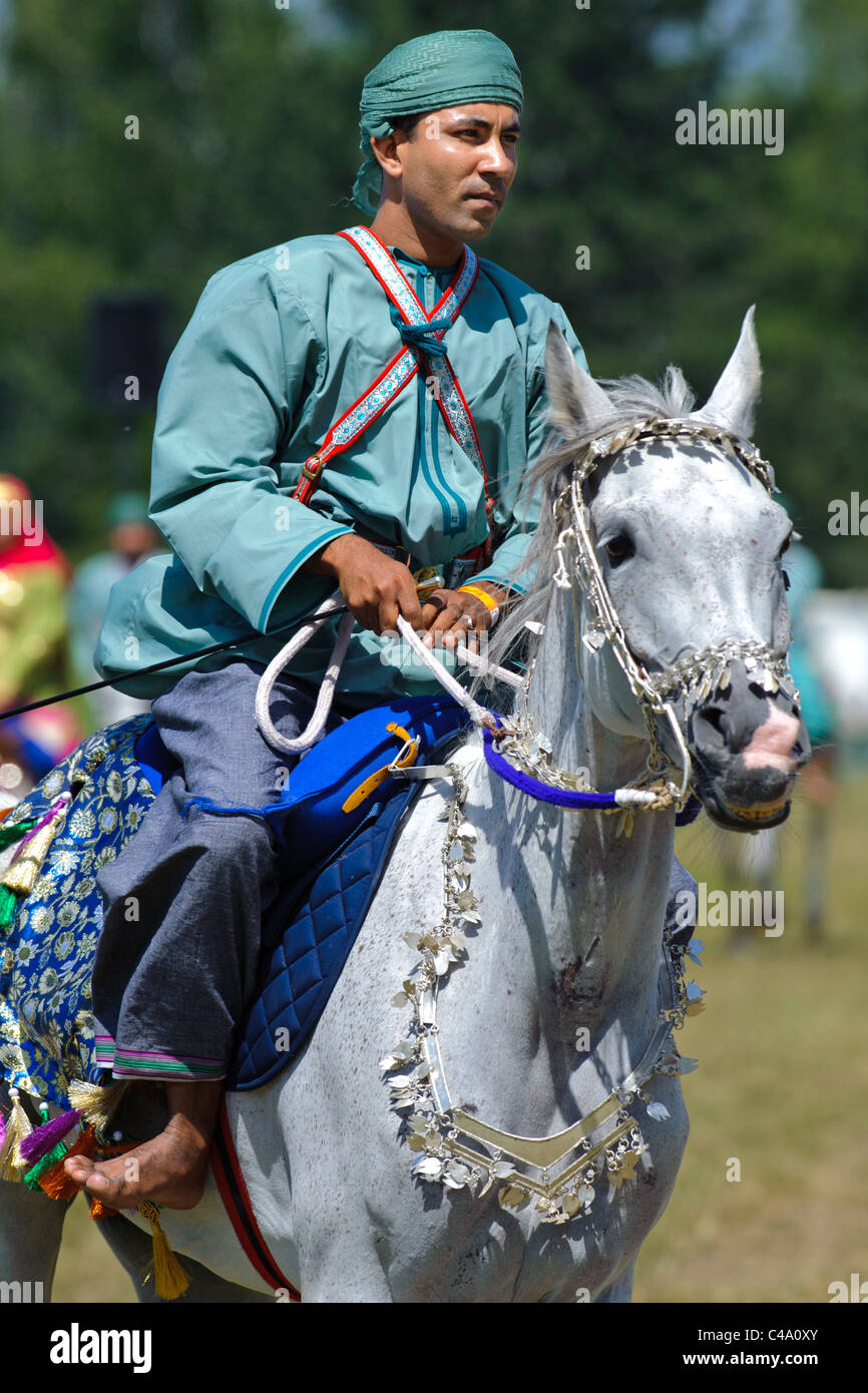 arabian Royal Cavalry of Oman in original costume on arabic horse while ...