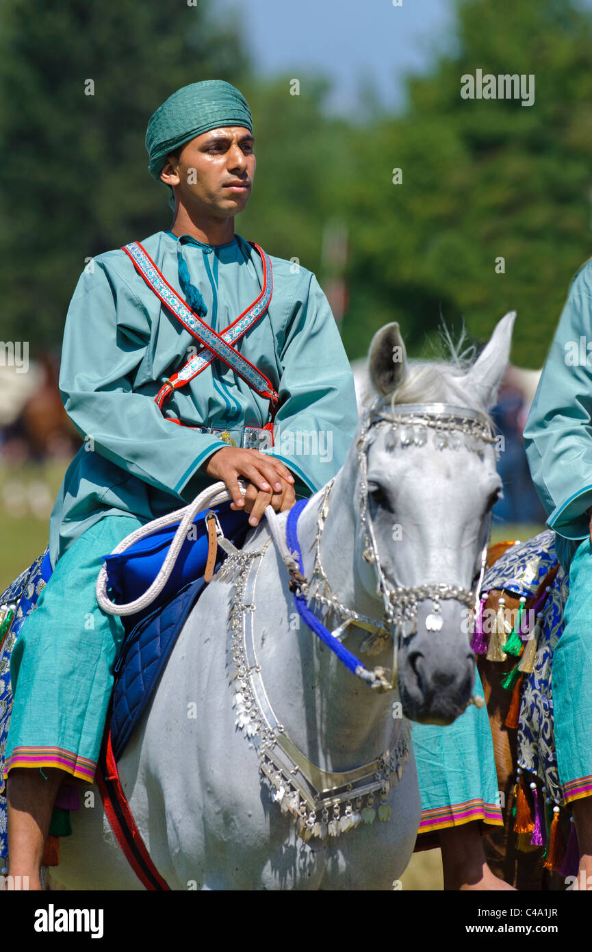 arabian Royal Cavalry of Oman in original costume on arabic horse while ...