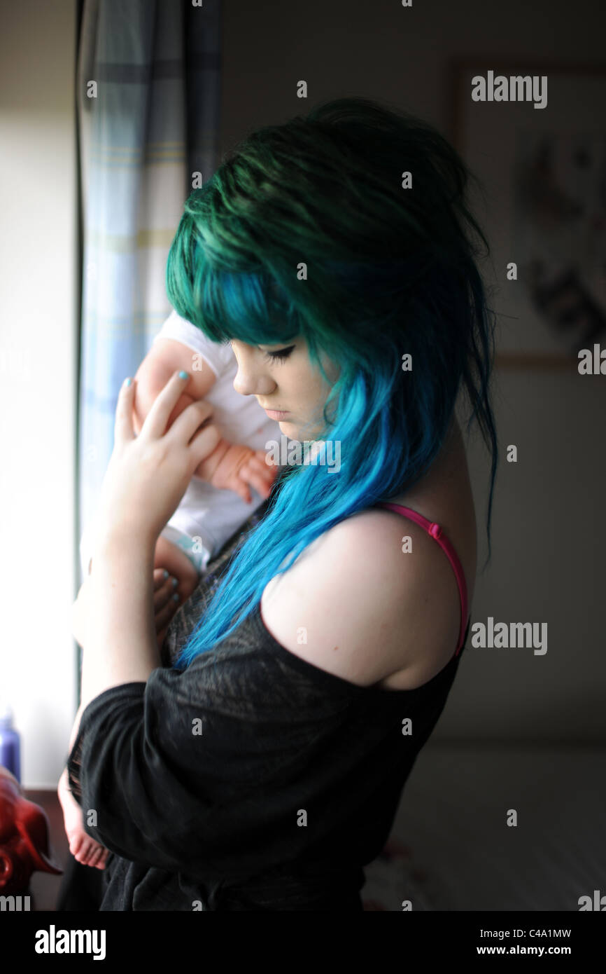 Teen Mother Holding a Baby Stock Photo - Alamy